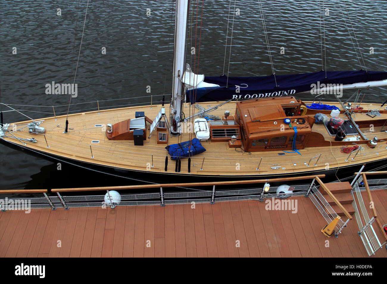 Racing yacht Bloodhound berthed next to the Royal Yacht Britannia ...