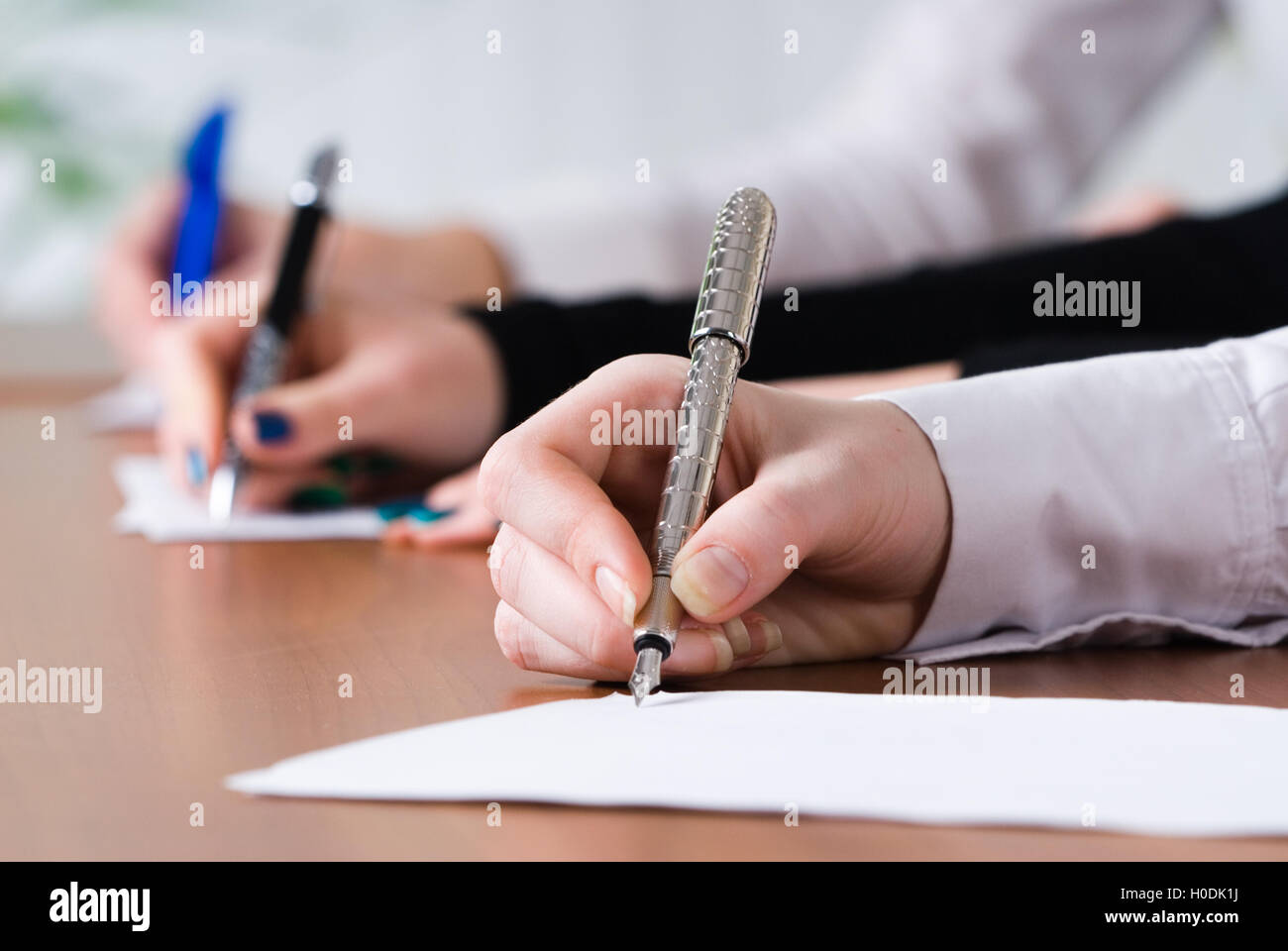 Girls hand holding pen writing hi-res stock photography and images - Alamy