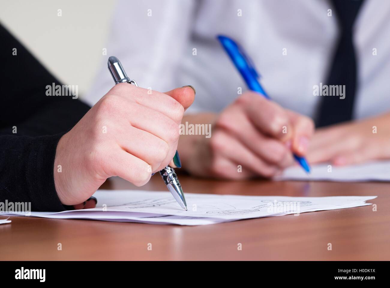 Girls hand holding pen writing hi-res stock photography and images - Alamy
