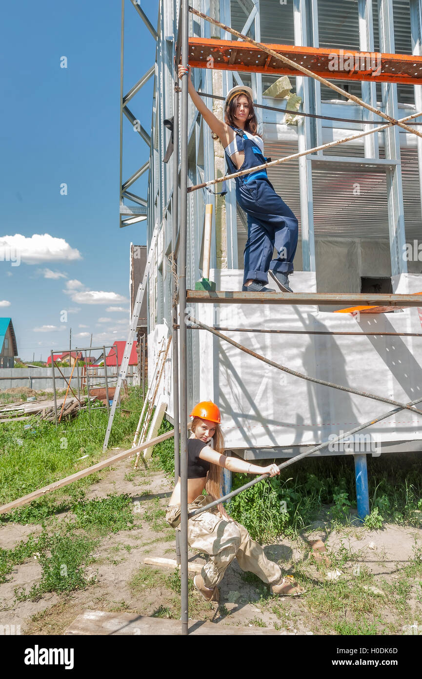 Attractive women on construction site Stock Photo - Alamy