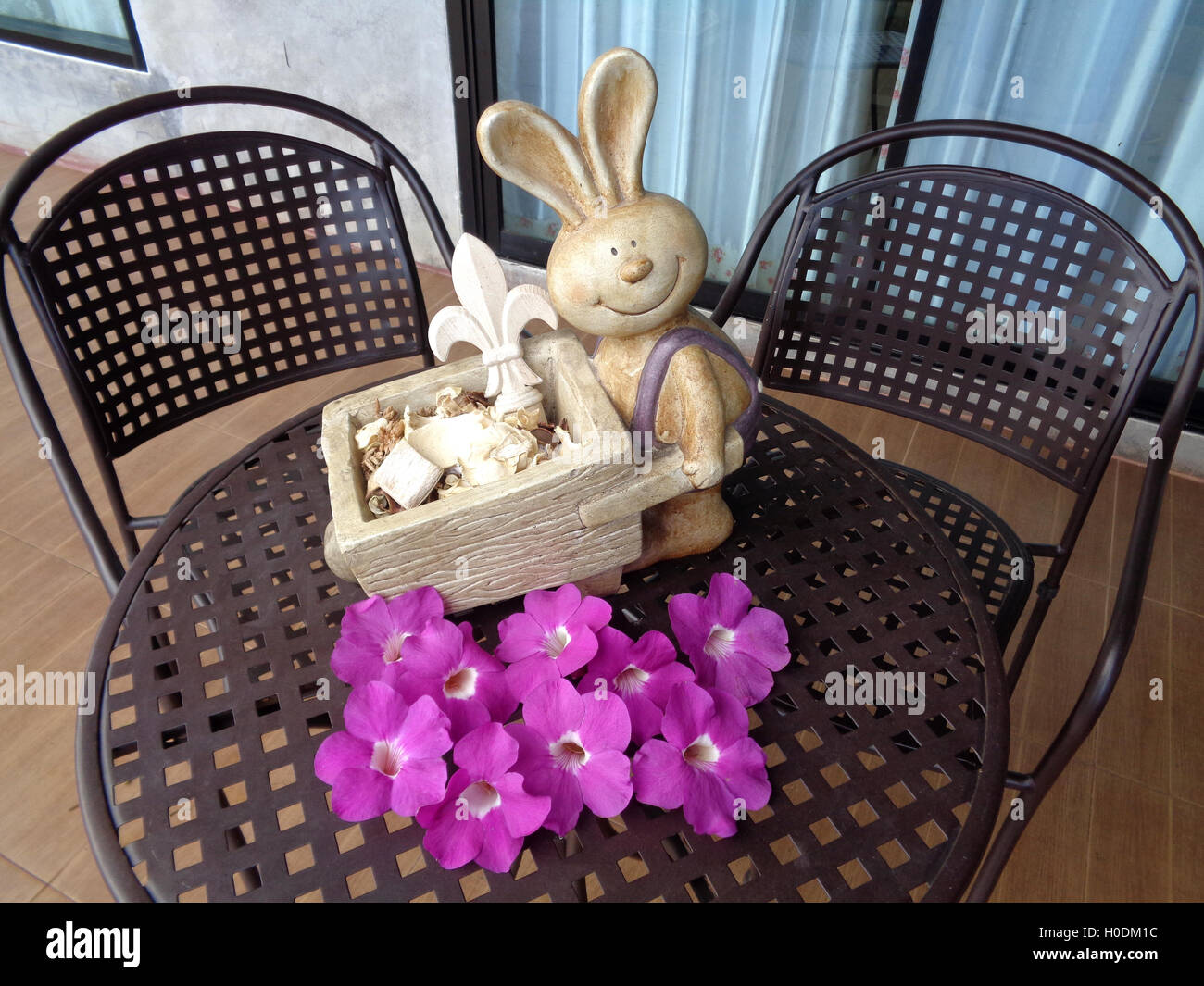 A Cozy Corner with Iron Tea Table at the Terrace Stock Photo - Alamy