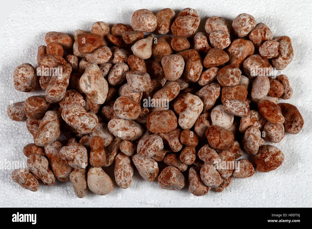 Group of small red stones for decoration engineering Stock Photo - Alamy