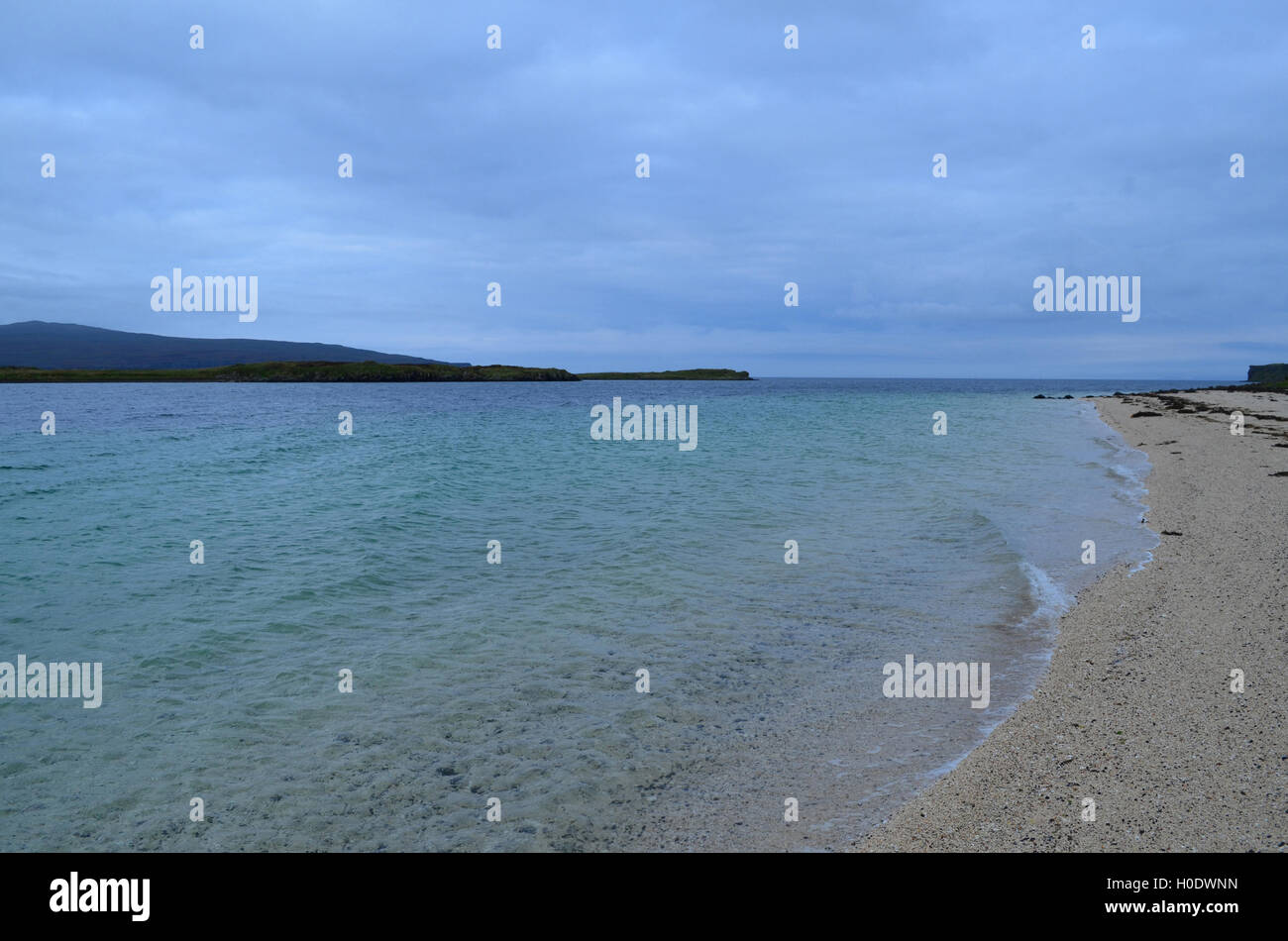 Gentle waves coming ashore on Claigan coral beach Stock Photo - Alamy
