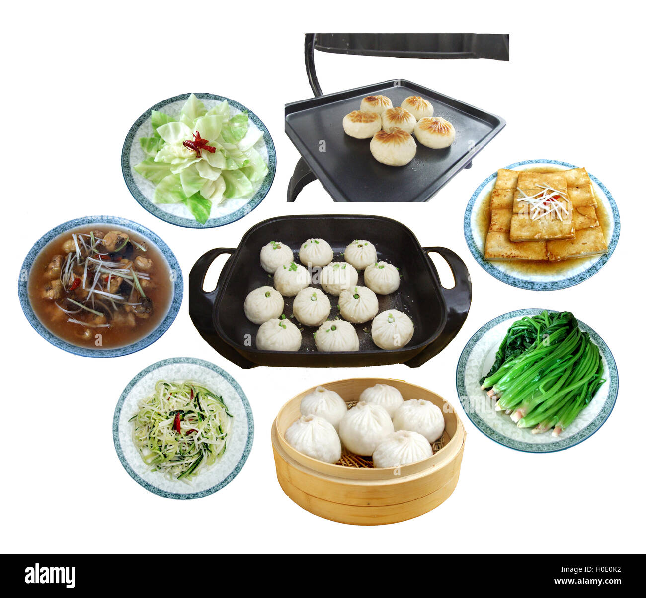 Plenty of dumplings, dim sum, tofu and vegetables on white background ...