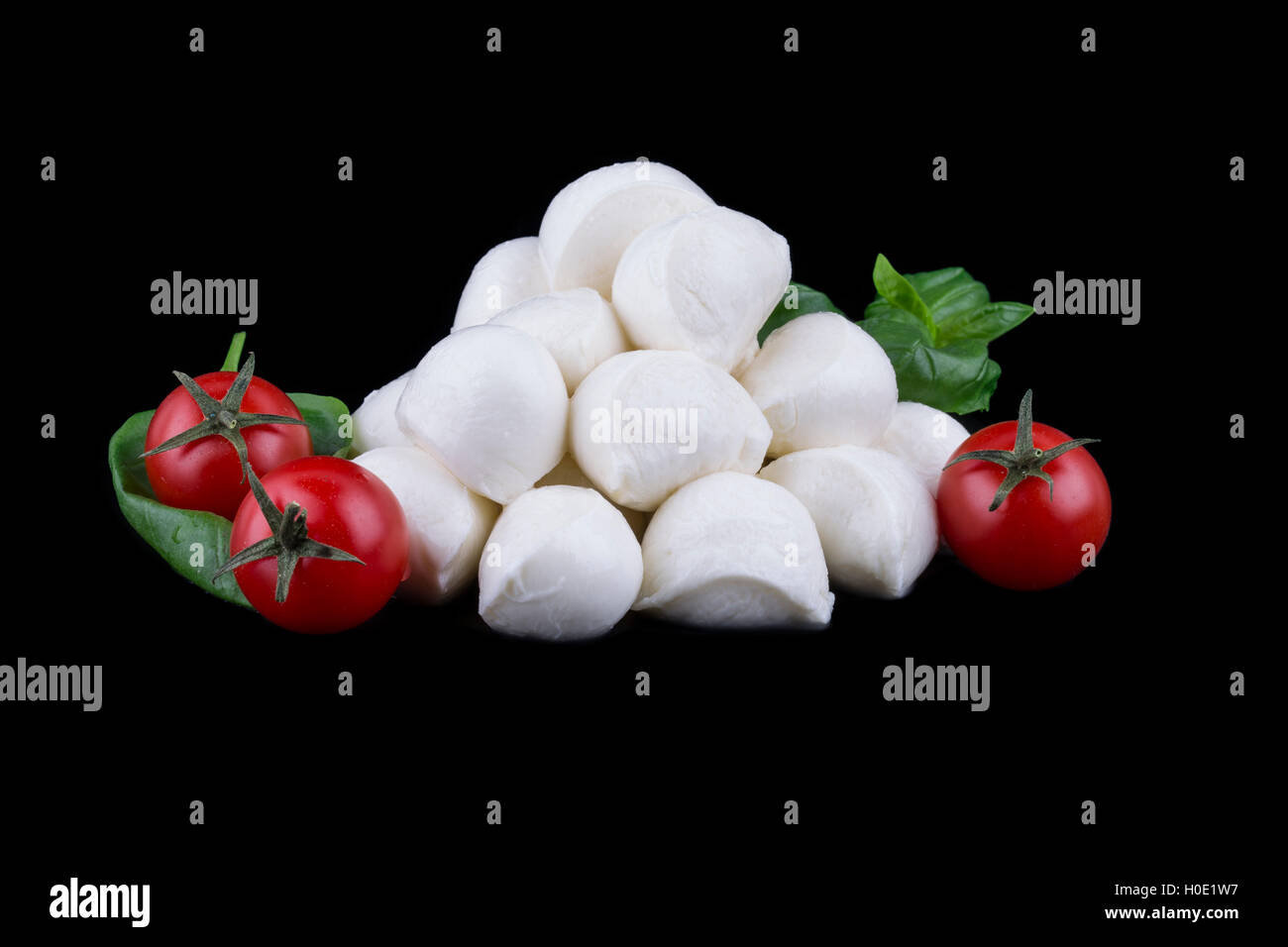 Buffalo mozzarella cheese made from milk Alibovalo on black background ...