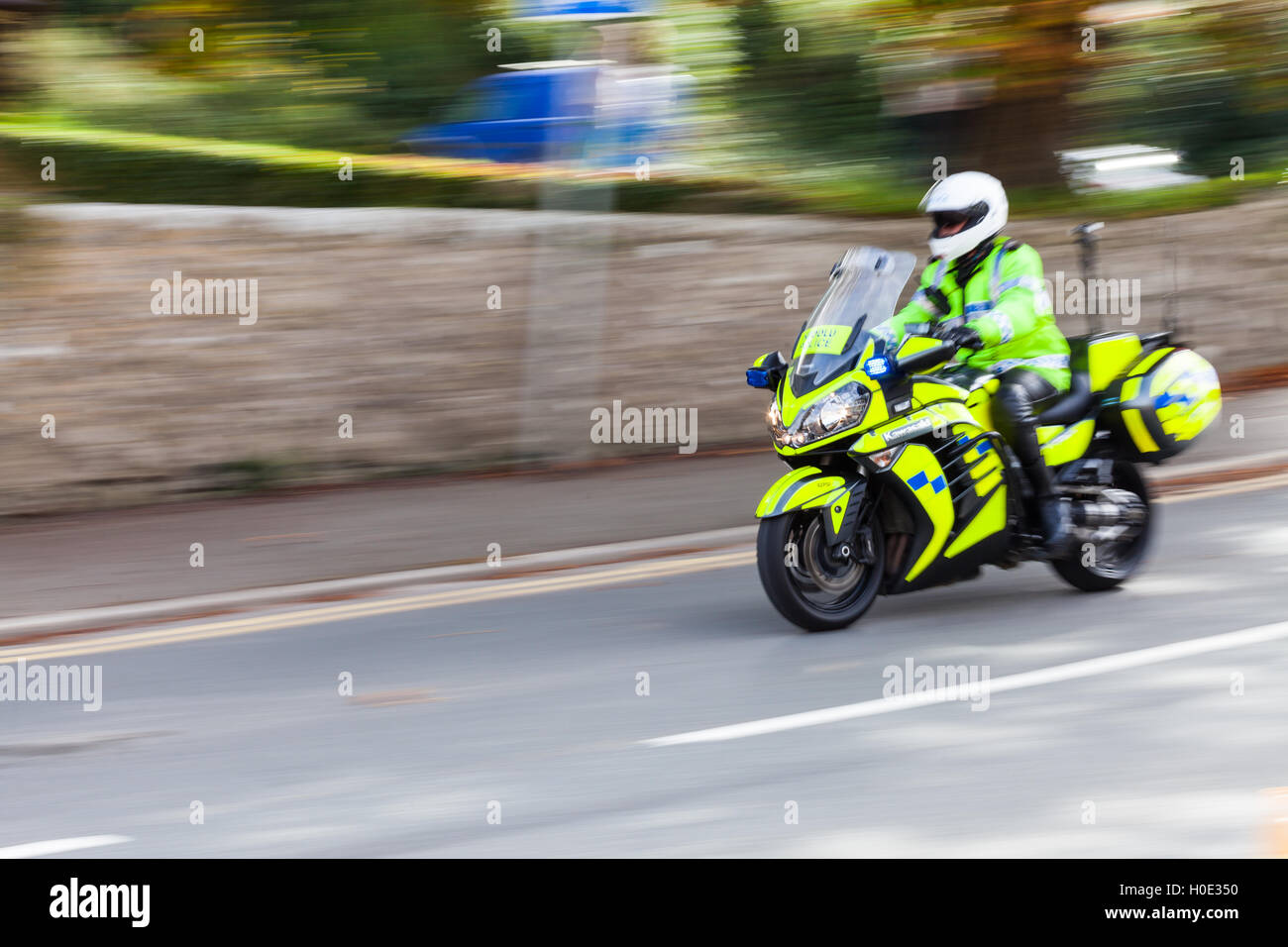 Police Motorbike moving with blurred background Stock Photo - Alamy