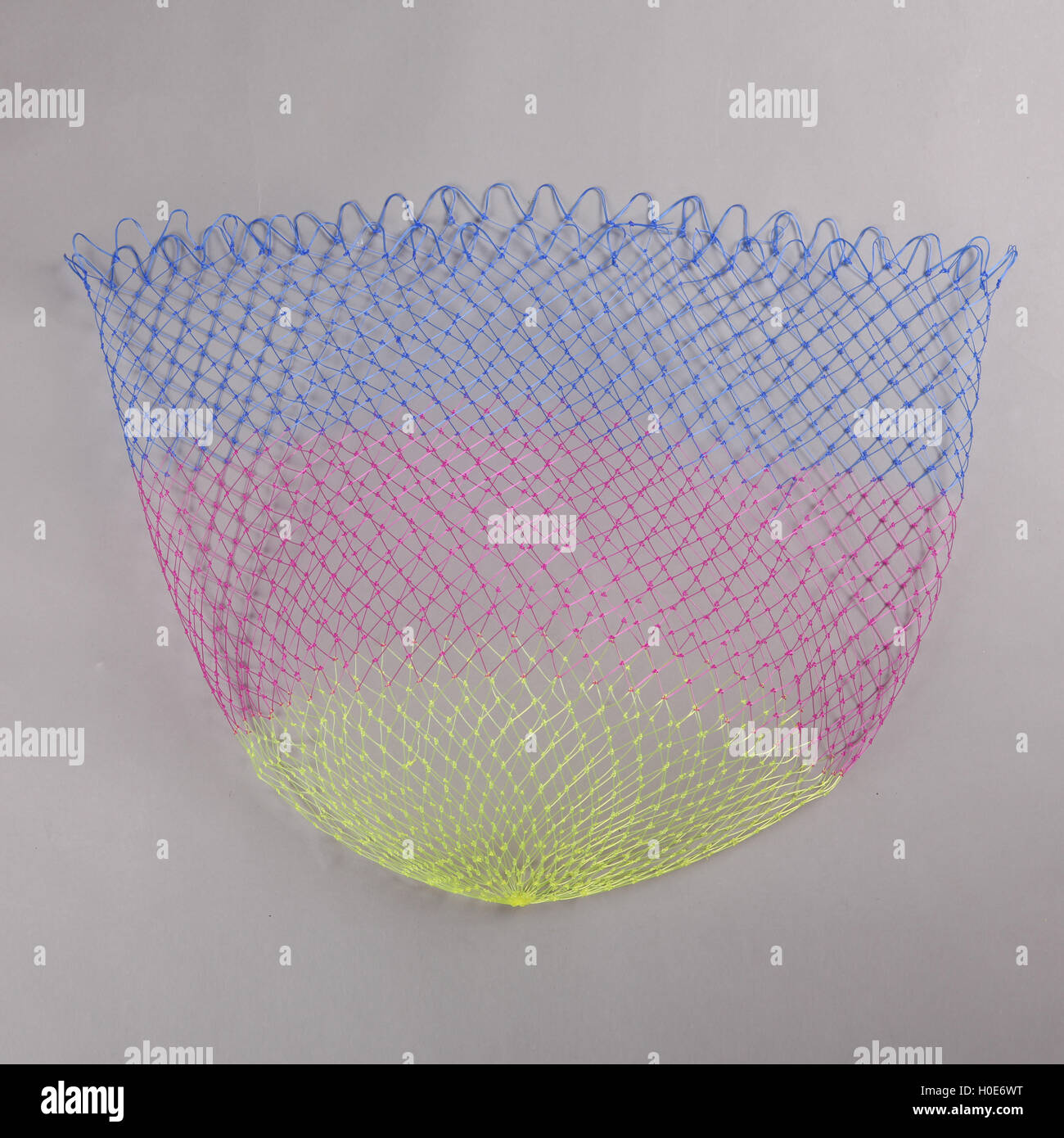 Harvest gear of nylon grass nets for fishing on grey background Stock ...