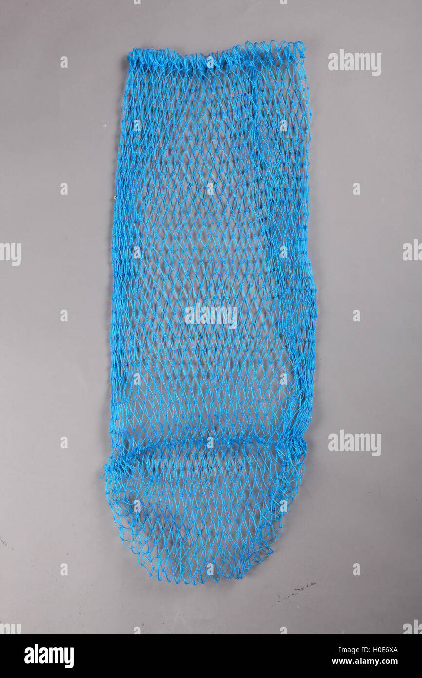 Harvest gear of nylon grass nets for fishing on grey background Stock ...