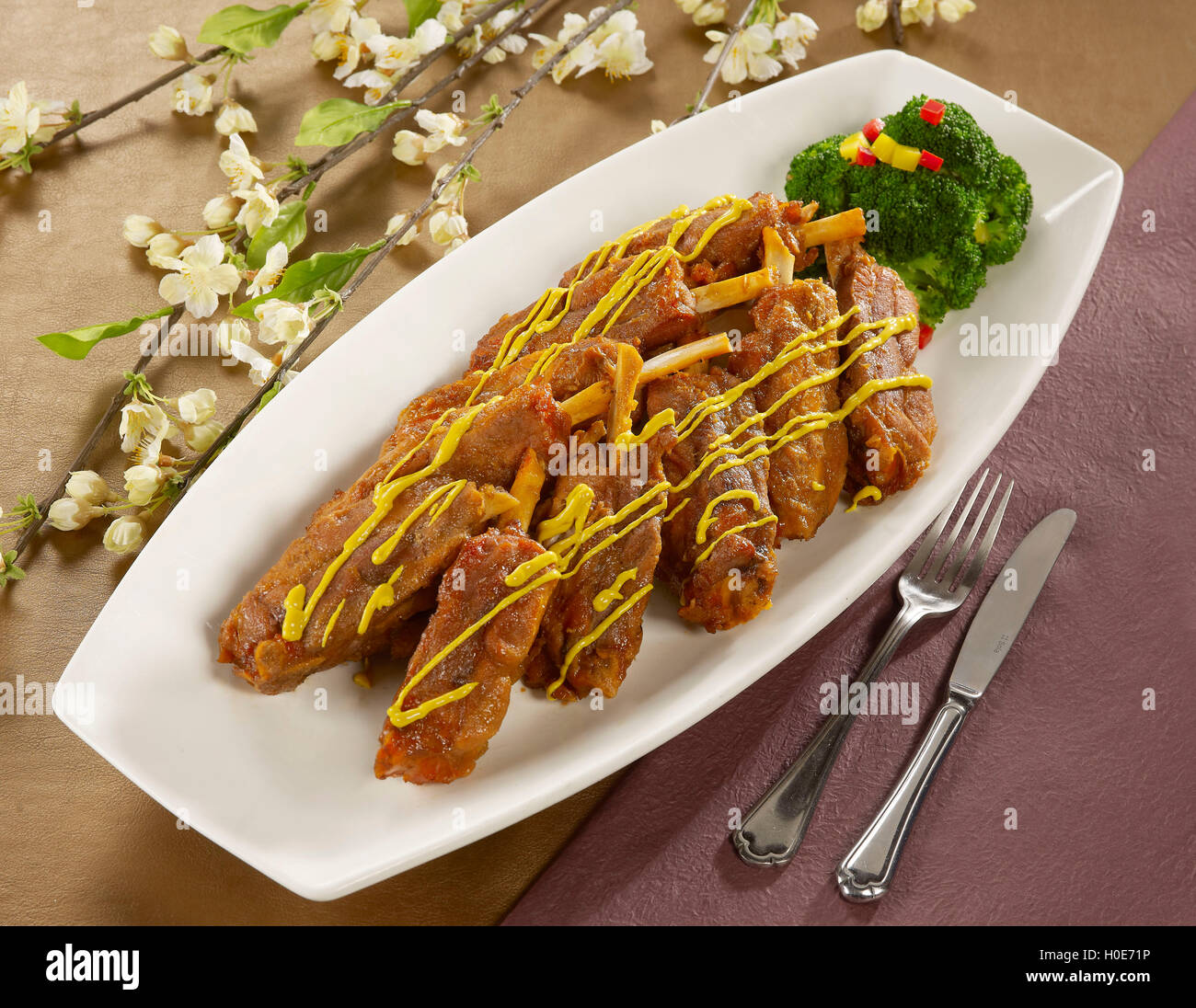 French pig tendon bone on white plate in restaurant Stock Photo - Alamy