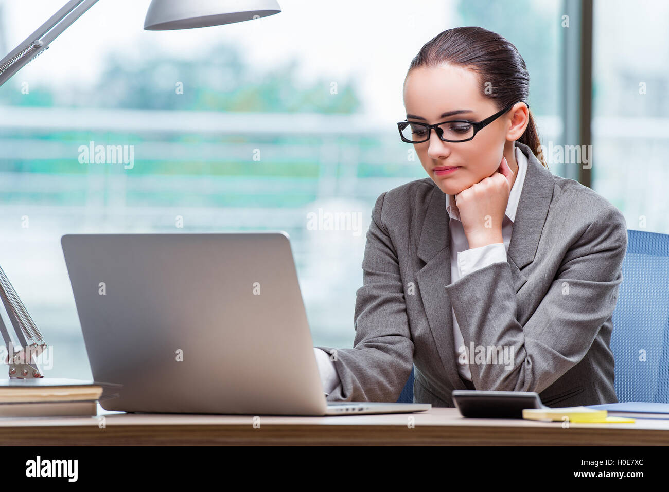 Young assistant working in the office Stock Photo - Alamy