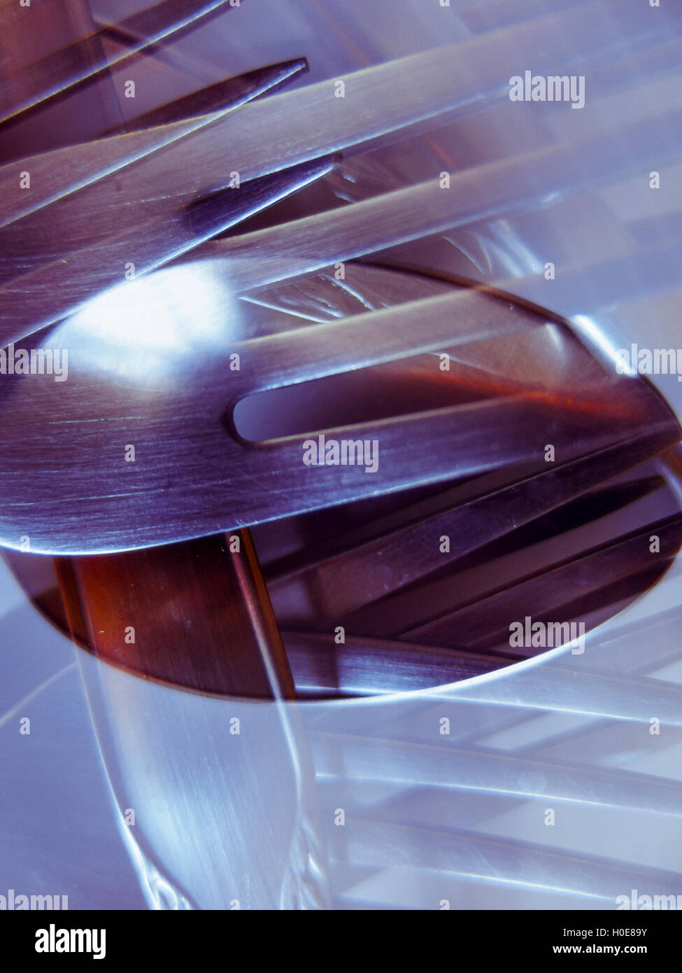 Double exposure in the same frame of forks and spoons Stock Photo - Alamy