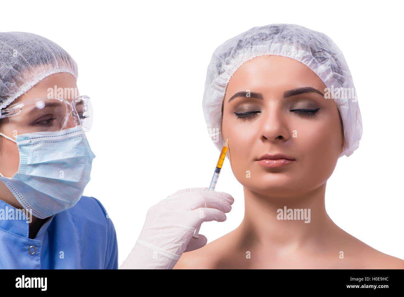 Young woman preparing for injection of botox isolated on white Stock ...