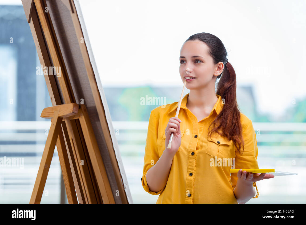 Young student artist drawing pictures in studio Stock Photo - Alamy