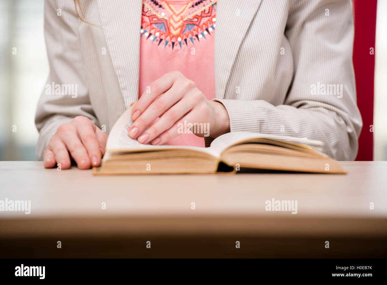 Young student reading book in preparation for exams Stock Photo - Alamy