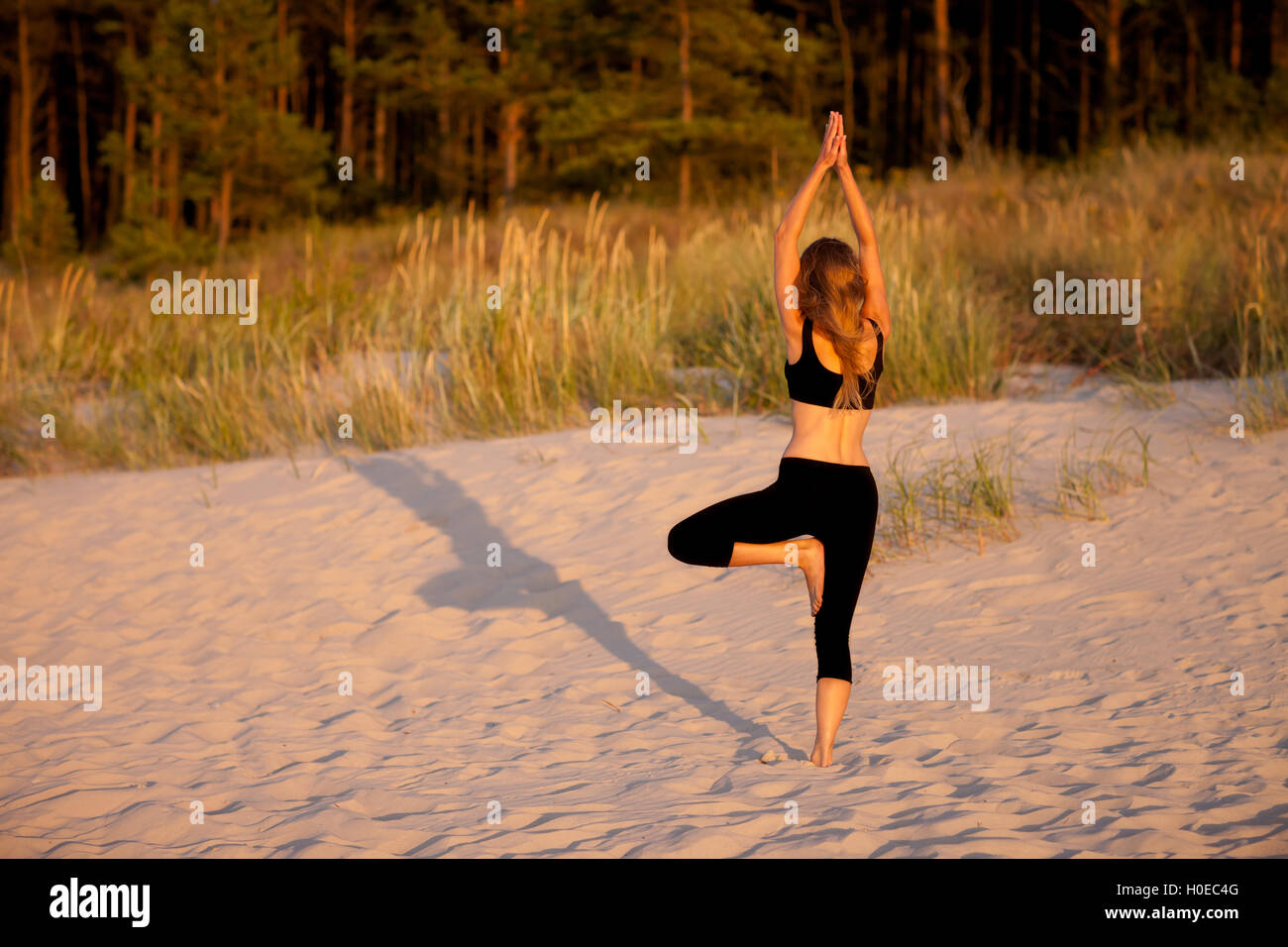 Summer yoga session on a beautiful golden beach - polish Grzybowo ...