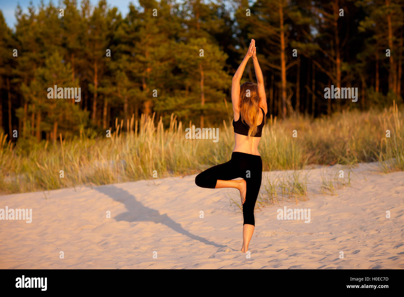 Summer yoga session on a beautiful golden beach - polish Grzybowo ...