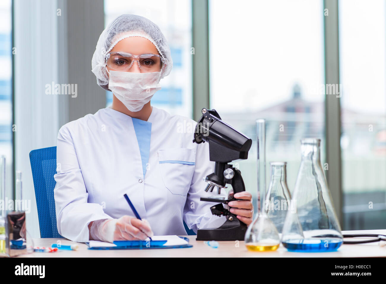 Young student working with chemical solutions in lab Stock Photo - Alamy