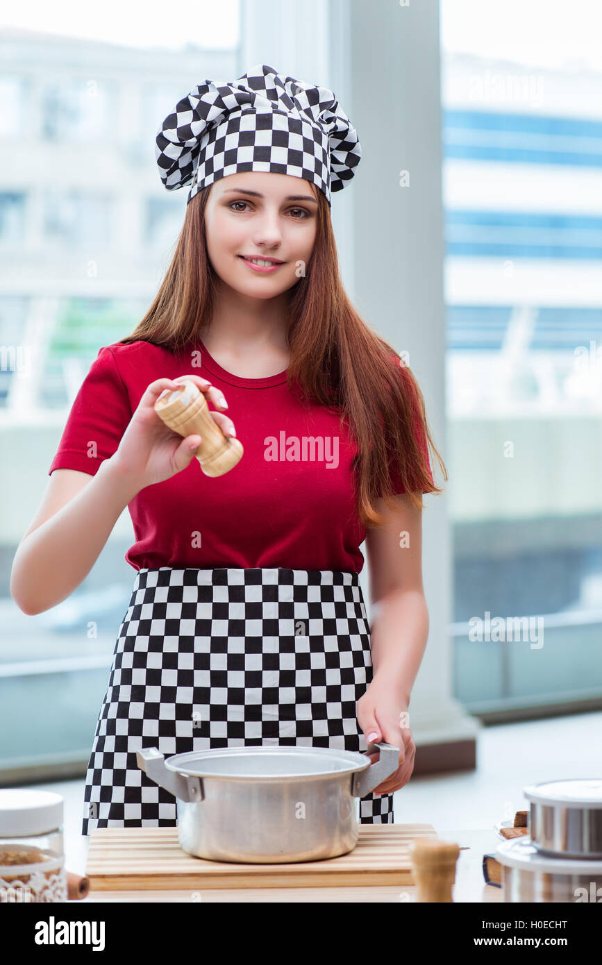 Young housewife preparing soup in kitchen Stock Photo - Alamy