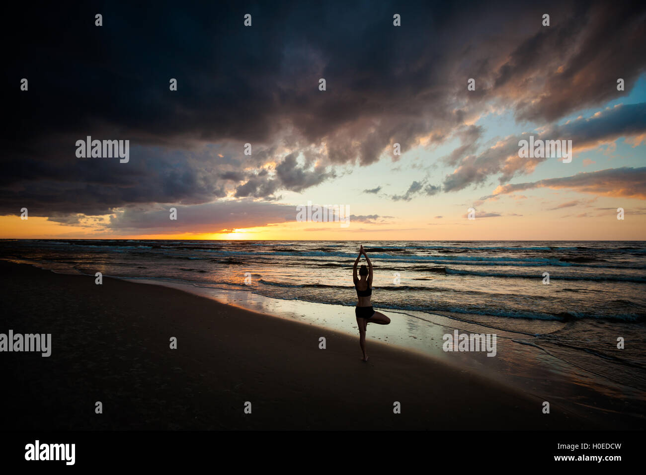 Summer yoga session on a beautiful golden beach - polish Grzybowo ...