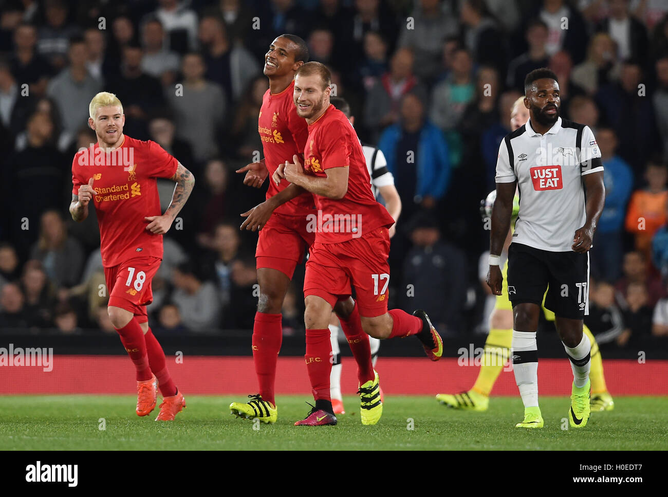 Liverpool's Ragnar Klavan (centre) celebrates scoring the first goal ...