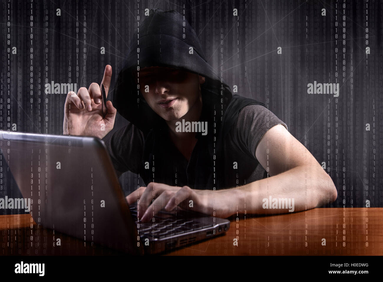 Young hacker in digital security concept Stock Photo - Alamy