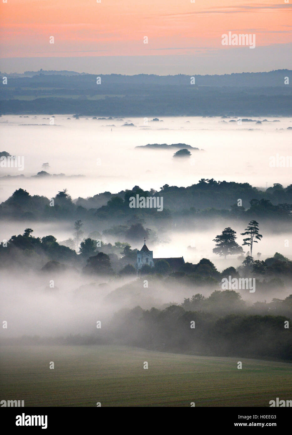 Firle church in mist Stock Photo - Alamy