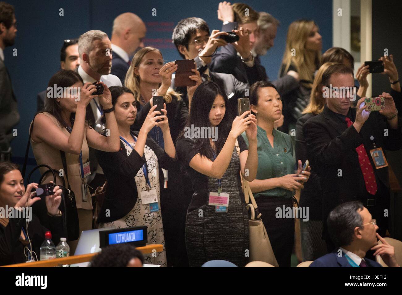 United Nations staff take photographs of Canadian Prime Minister Justin ...