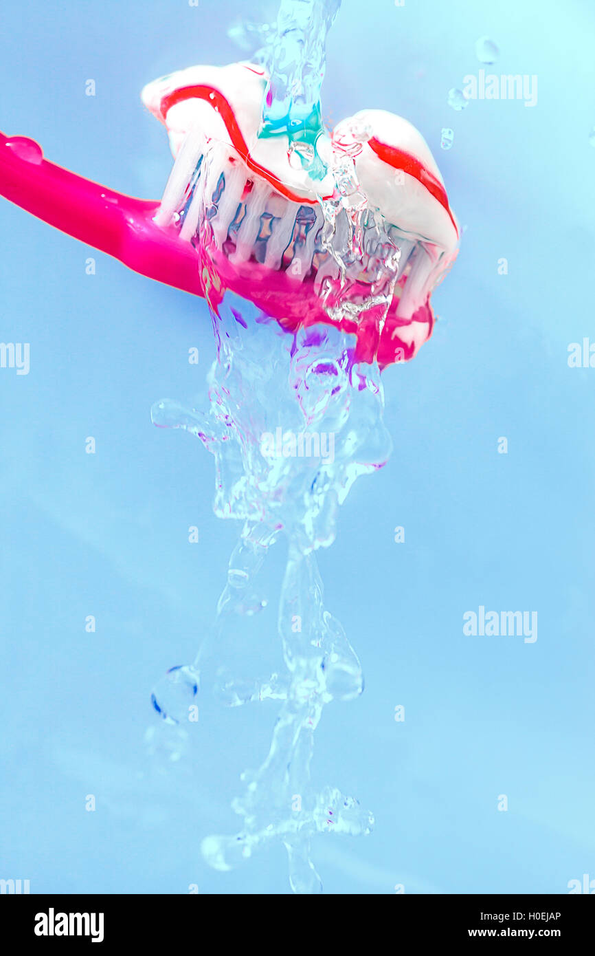 Toothbrush with water jet Stock Photo - Alamy