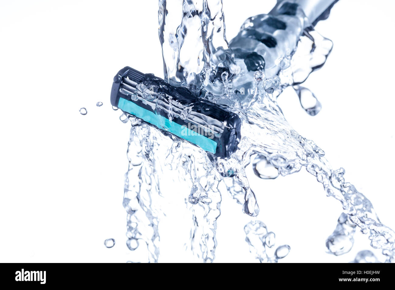 Disposable Razor with water splash Stock Photo - Alamy