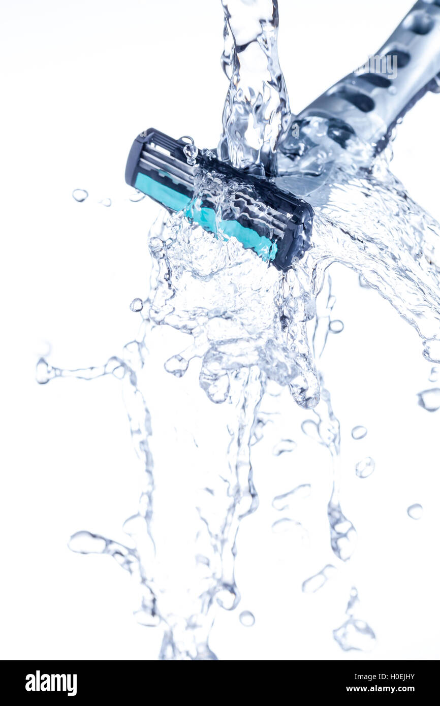 Disposable Razor with water splash Stock Photo - Alamy