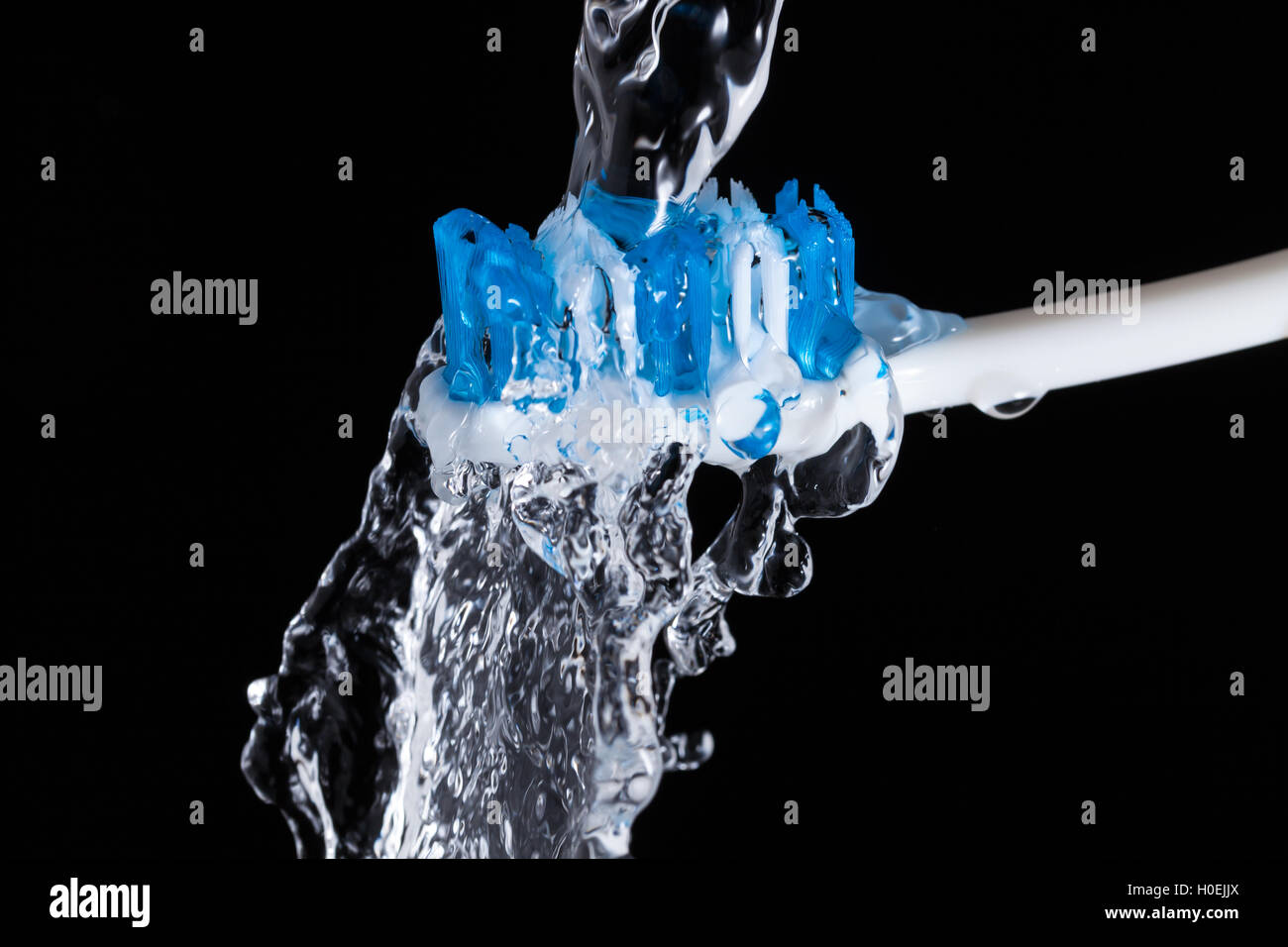Toothbrush with water jet Stock Photo - Alamy