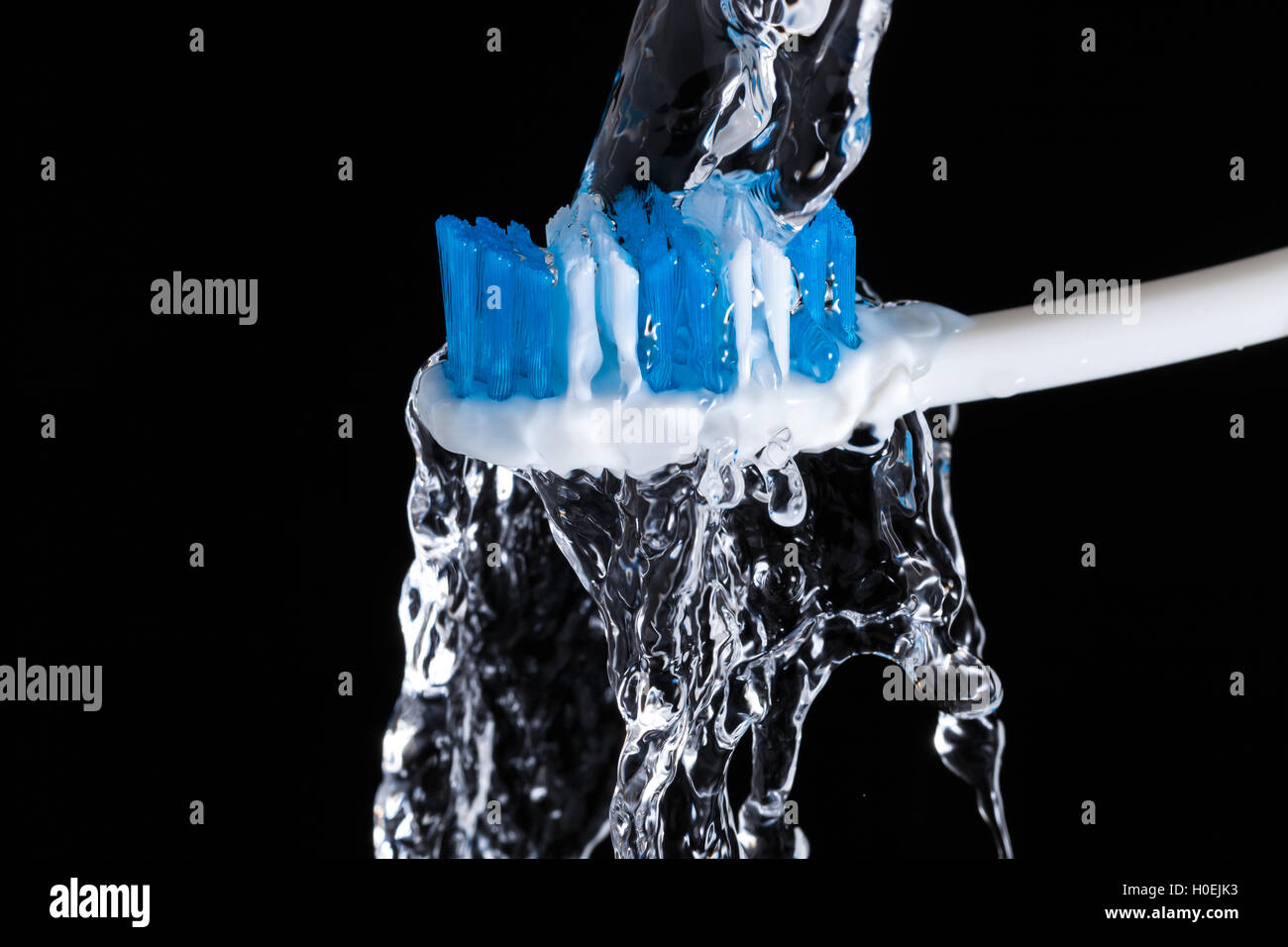 Toothbrush with water jet Stock Photo - Alamy