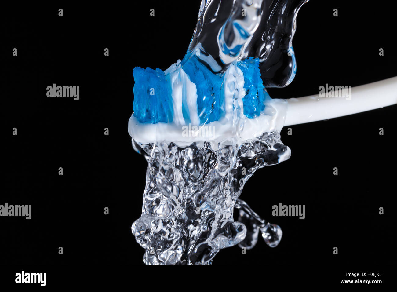 Toothbrush with water jet Stock Photo - Alamy