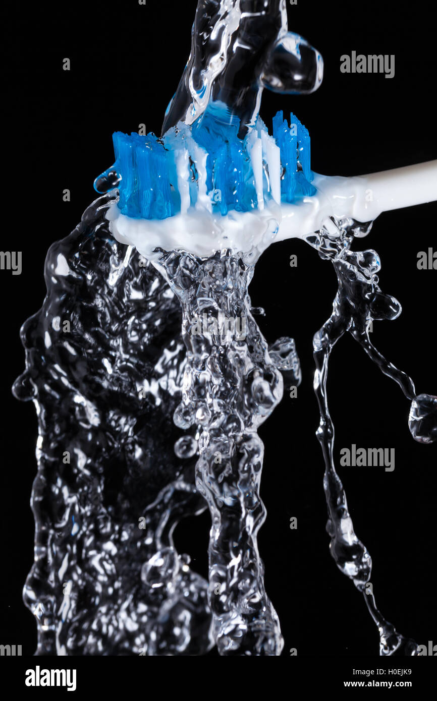 Toothbrush with water jet Stock Photo - Alamy