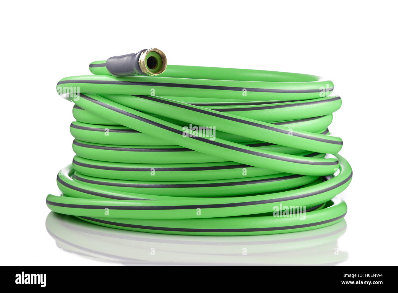 Long garden hose rolled-up isolated on white background Stock Photo - Alamy