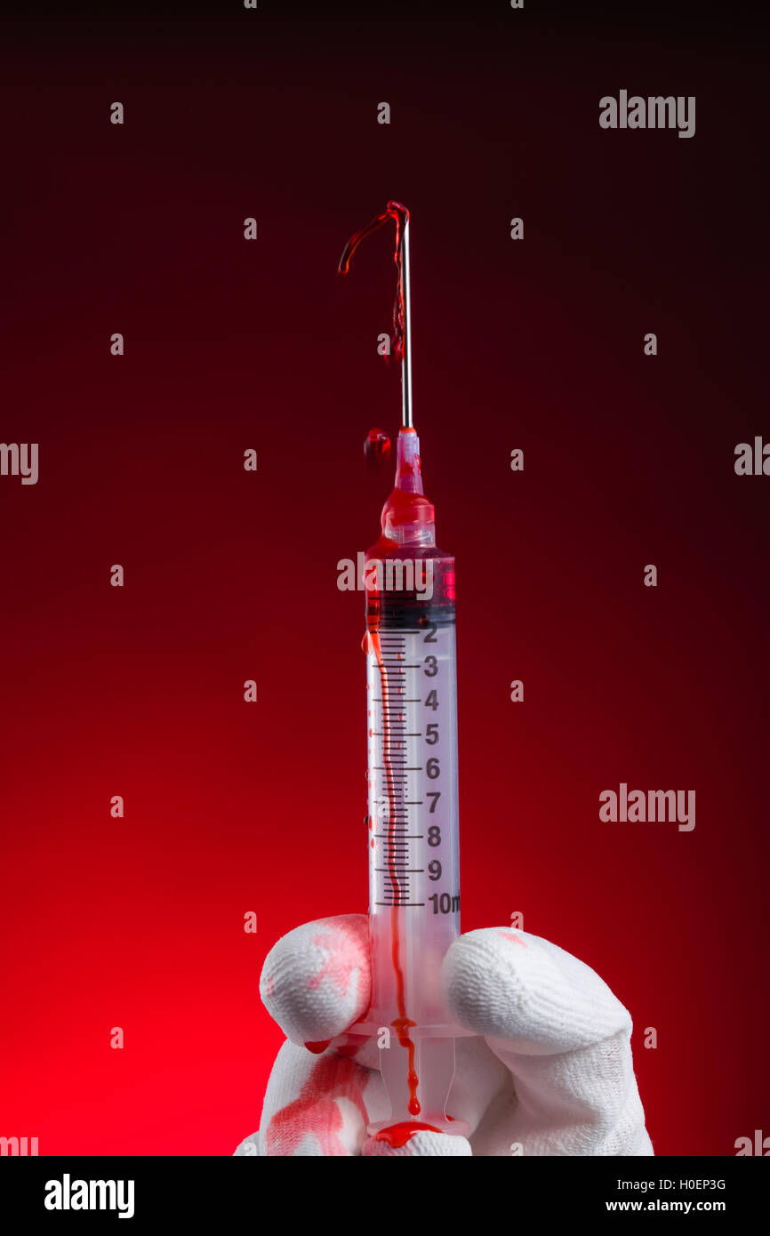 Blood drops syringe hi-res stock photography and images - Alamy