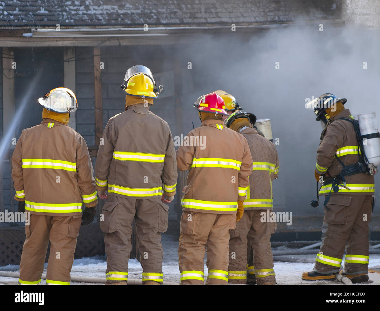 Firefighter in front of disaster Stock Photo - Alamy