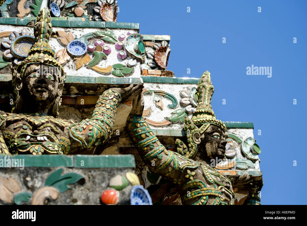 Garuda statues and porcelain ornaments on the central prang (khmer ...
