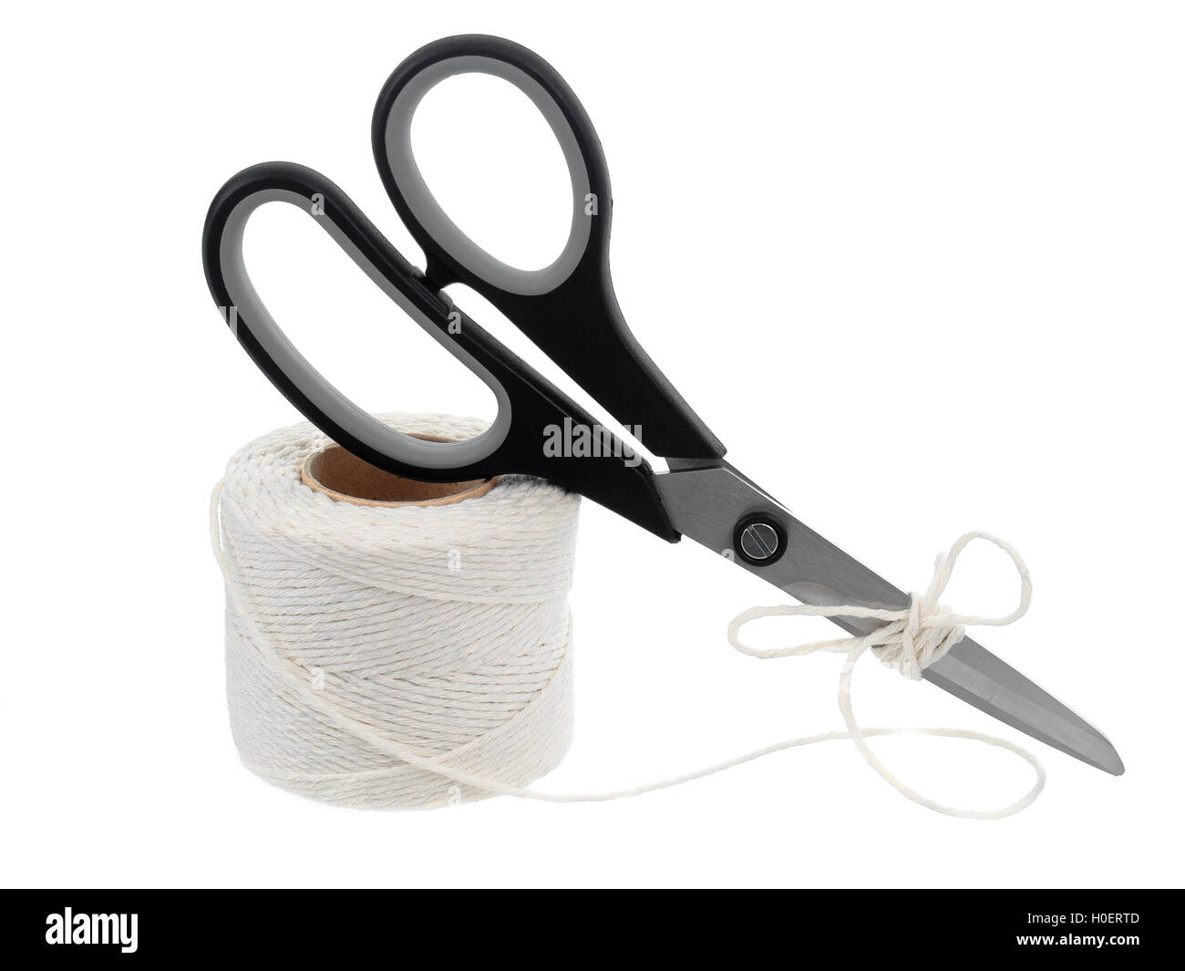 Roll of hemp string and scissor isolated on white Stock Photo - Alamy