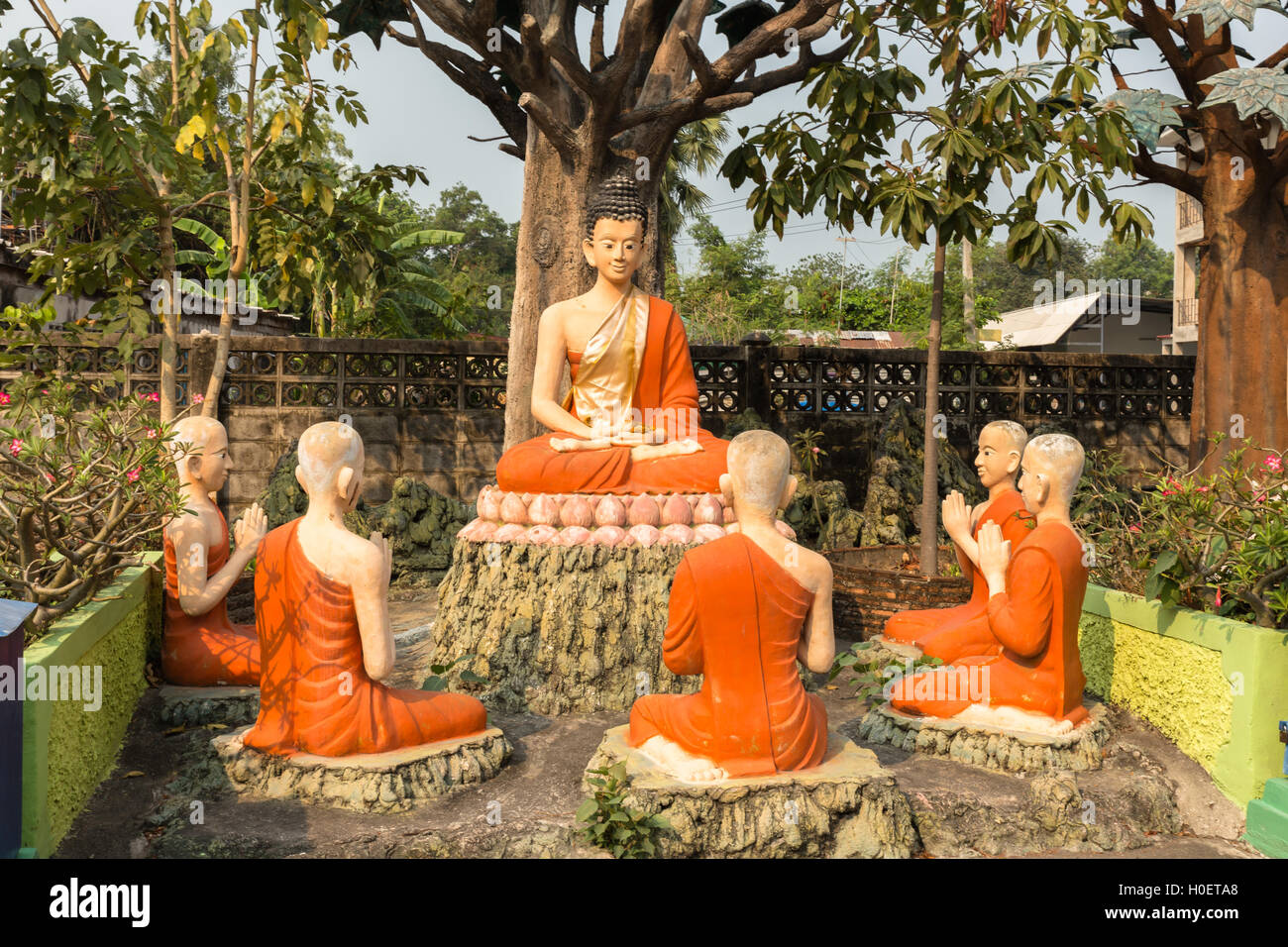Statues of Buddha and his followers Stock Photo - Alamy