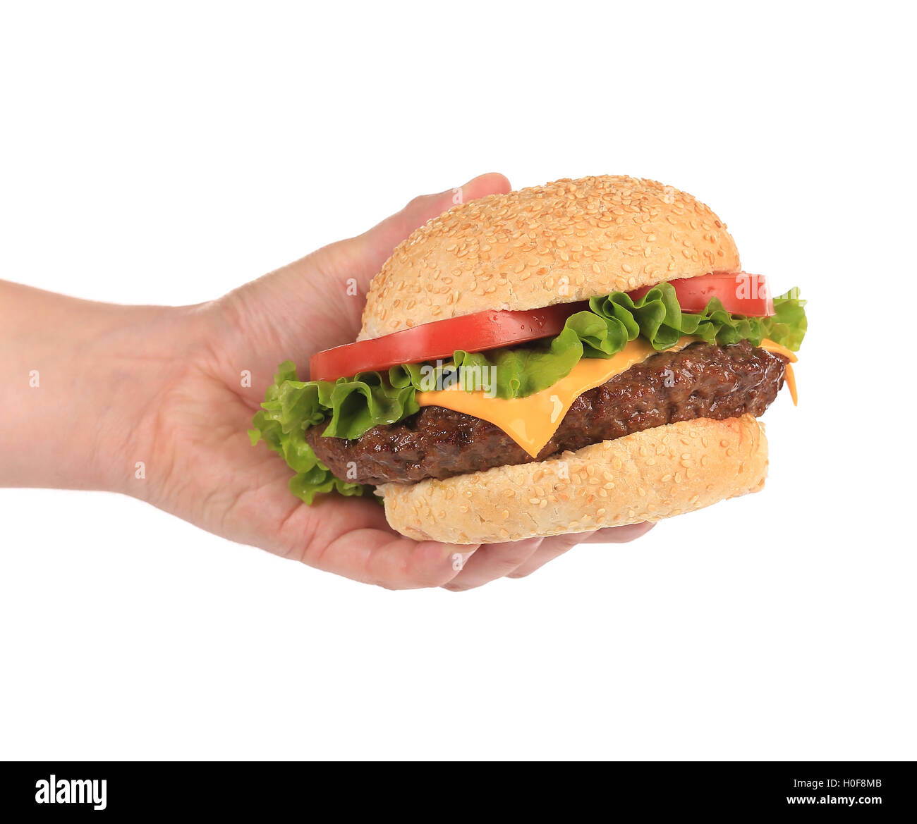 Big appetizing hamburger in hand Stock Photo - Alamy