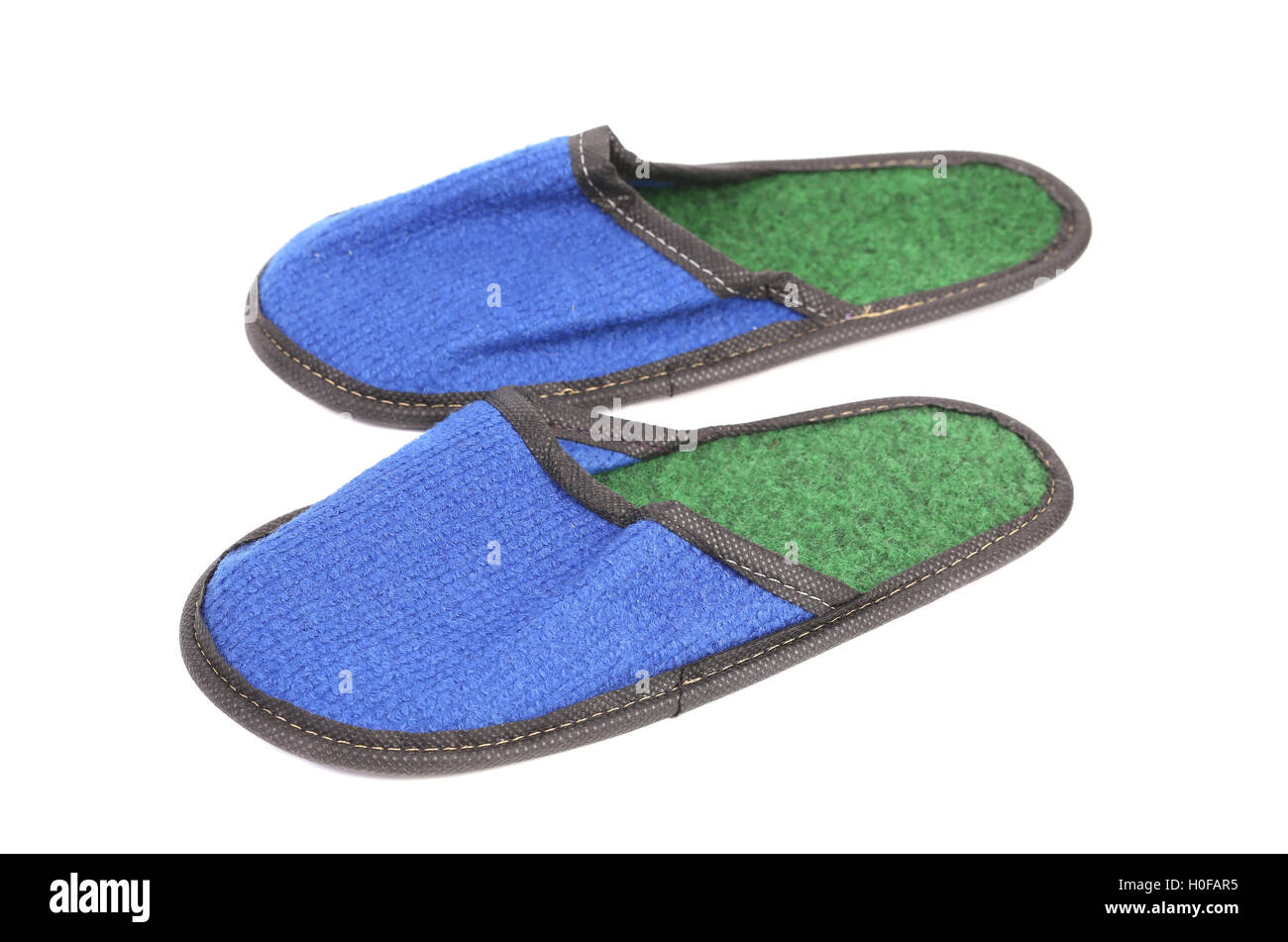 Bright pair of blue slippers Stock Photo - Alamy
