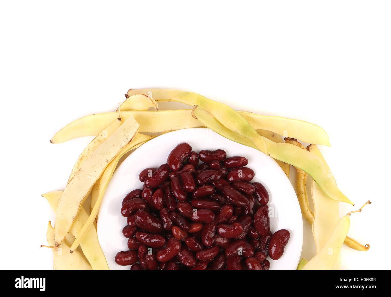 Composition of yellow pods and red beans Stock Photo - Alamy