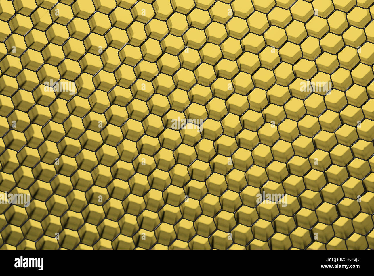 Close up of black net. Yellow light Stock Photo - Alamy