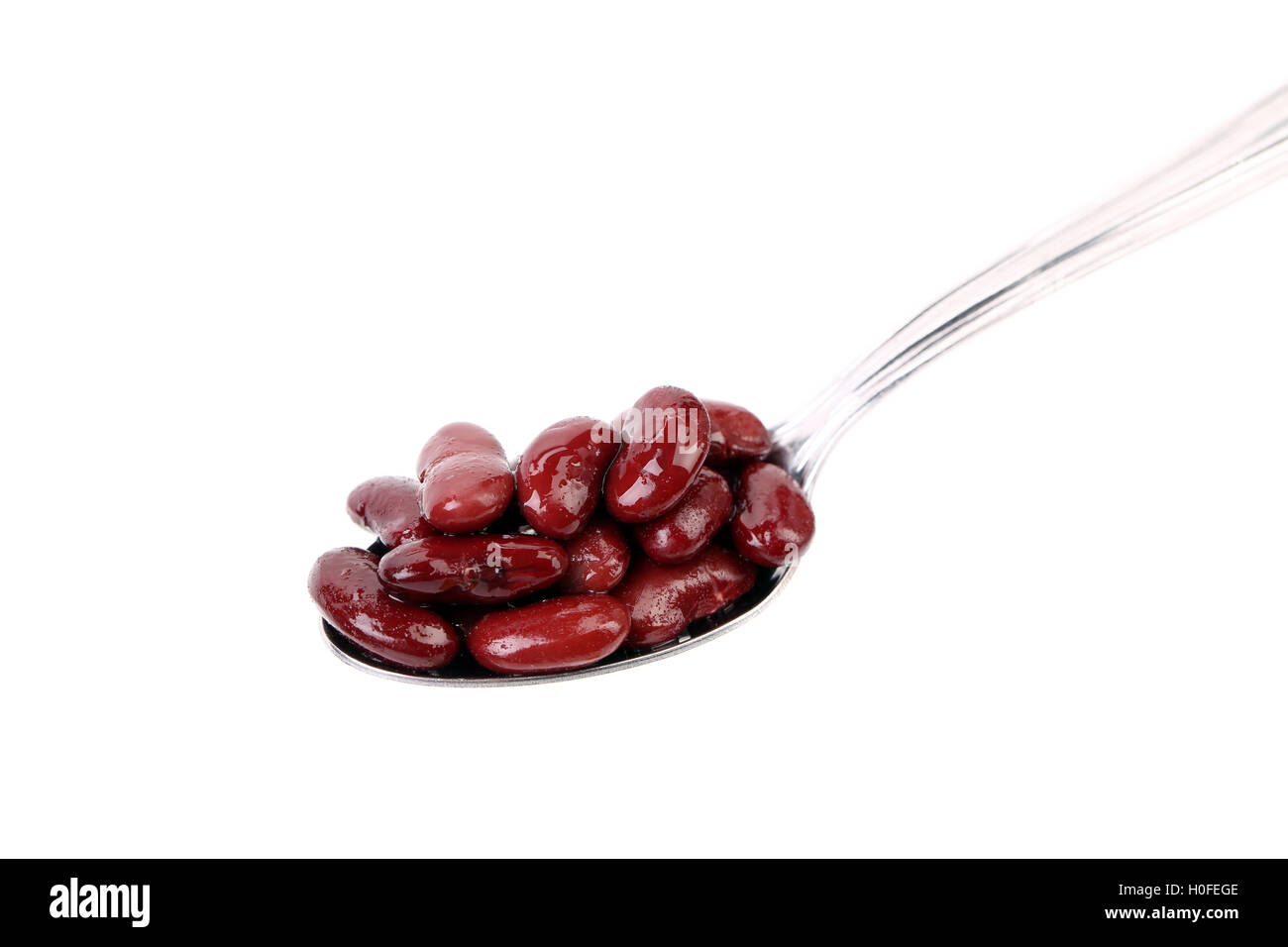 Preserve beans on a spoon Stock Photo - Alamy