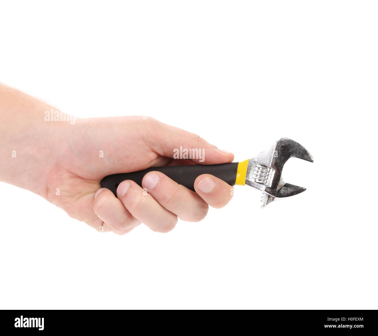 Hand holding adjustable wrench Stock Photo - Alamy