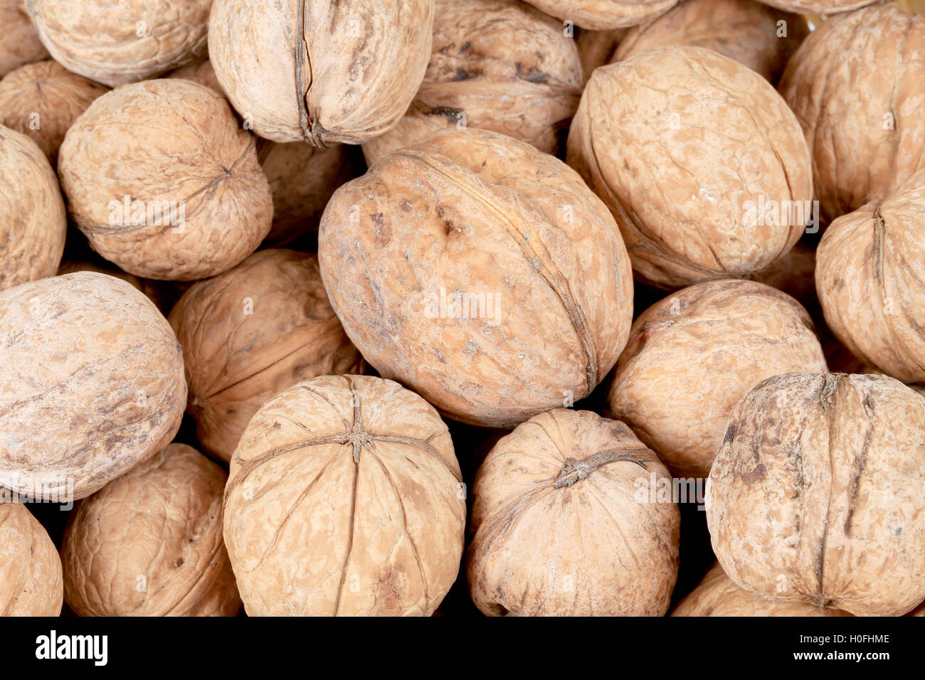 Bunch of walnuts whole Stock Photo - Alamy