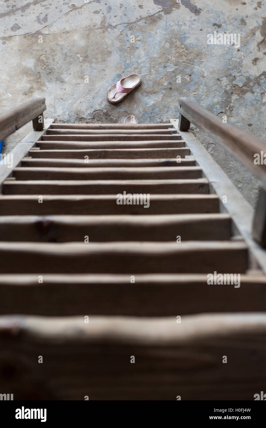 Sandal at bottom of staircase at front entrance of farmhouse, Haa ...