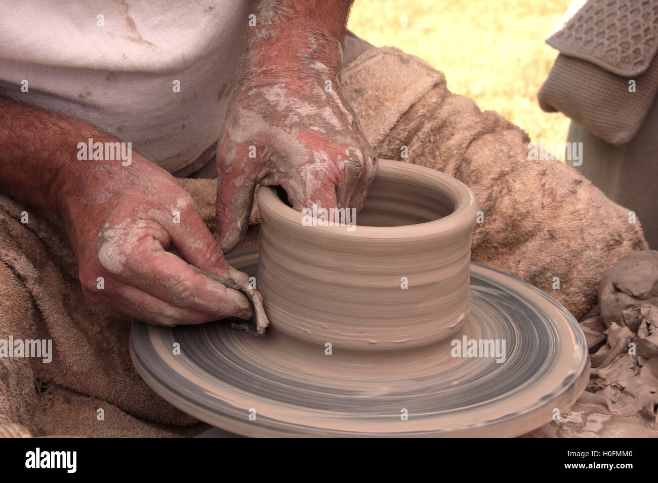 Hands shaping clay on pottery wheel Stock Photo - Alamy