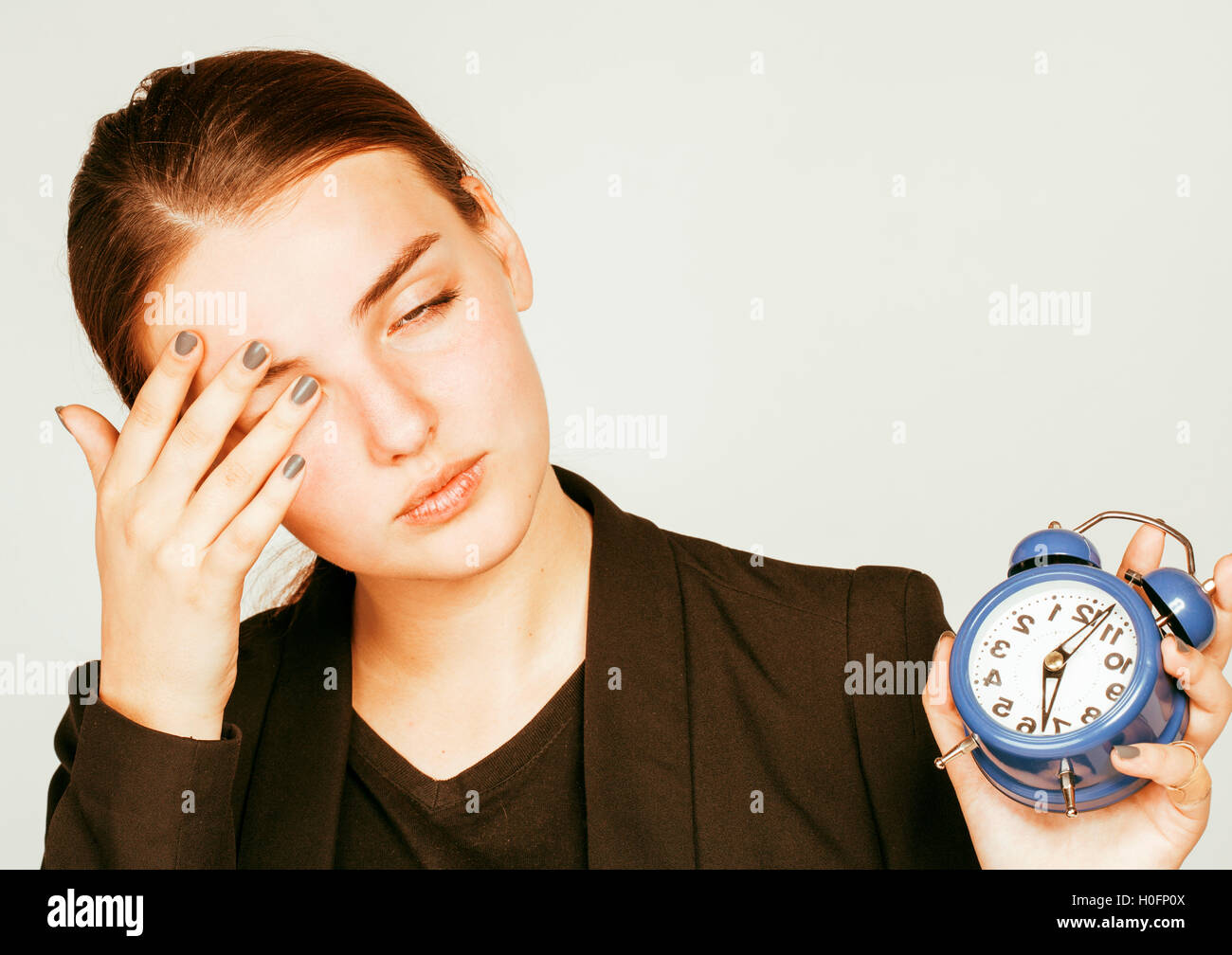 young beauty woman in business style costume waking up for work early ...